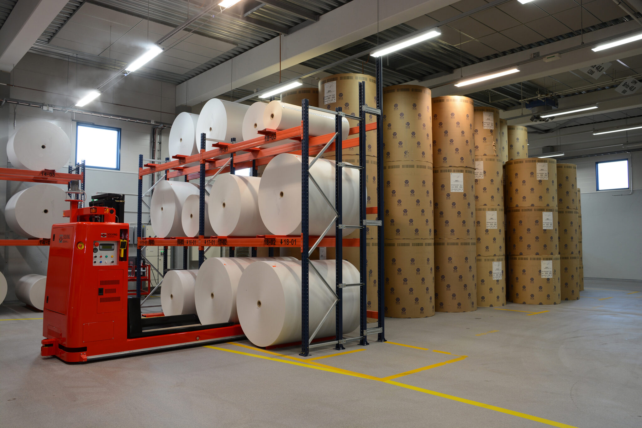 Roll handling systems & Automated paper roll movers | Solving
